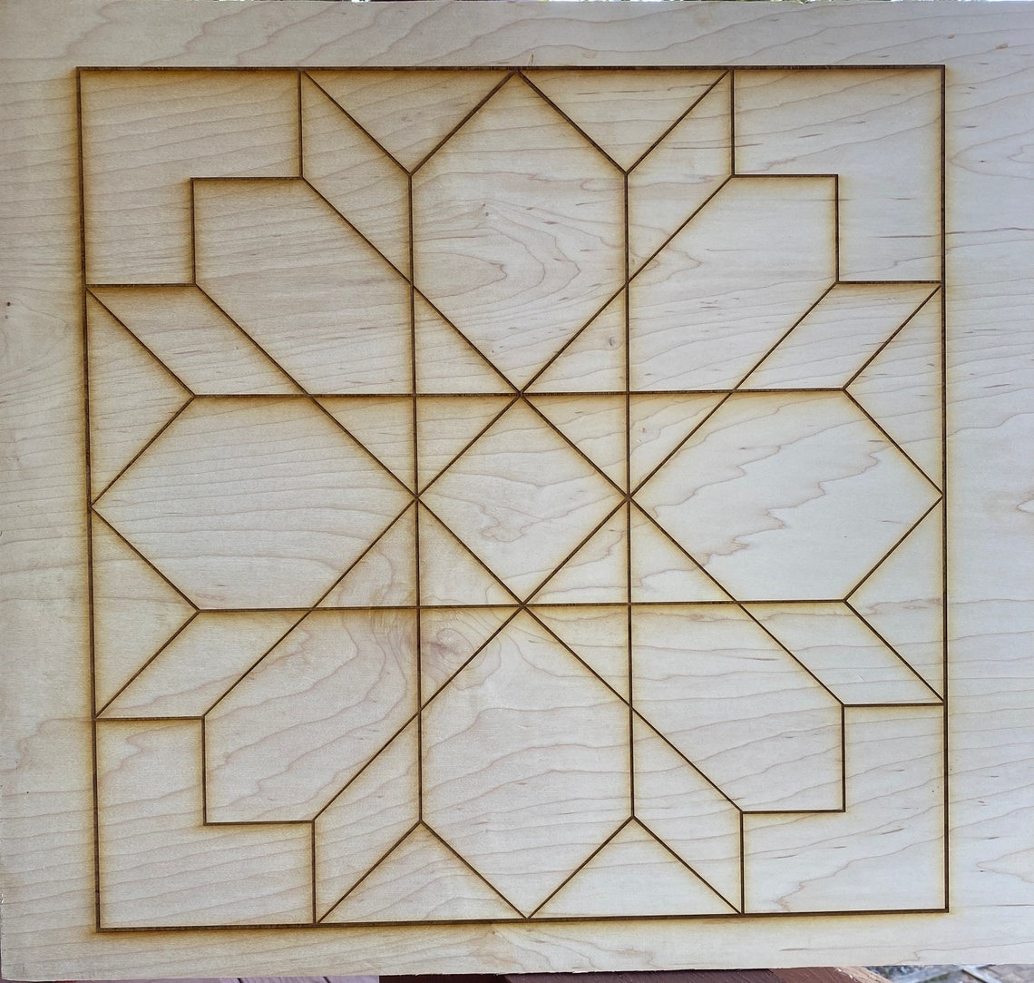 Rough Wooden Barn Quilt Block with a Flower-Shaped Laser Beam